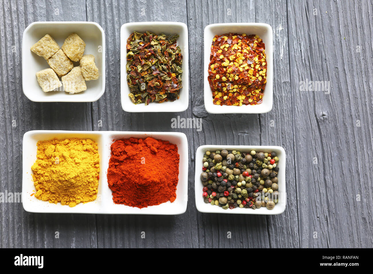 Set of Various spices on black stone table. Top view Stock Photo - Alamy