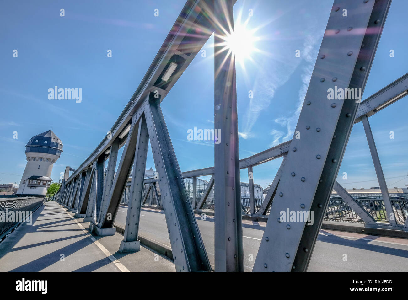 Bridge built out of steel beams in bright sunlight with rays of light ...