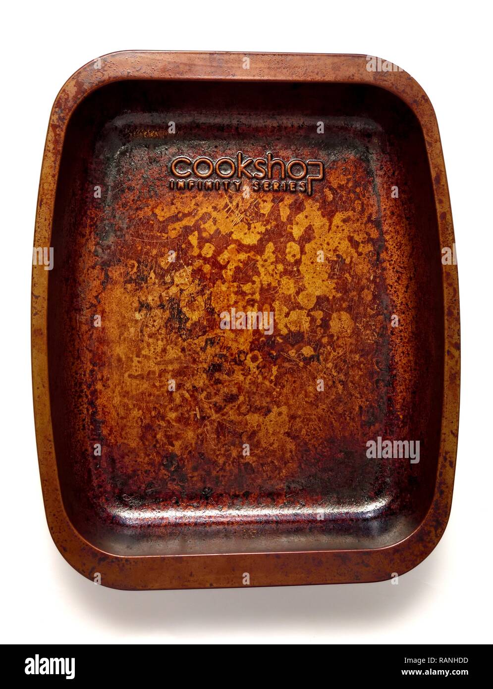 A well used burnt cooking tin Stock Photo - Alamy