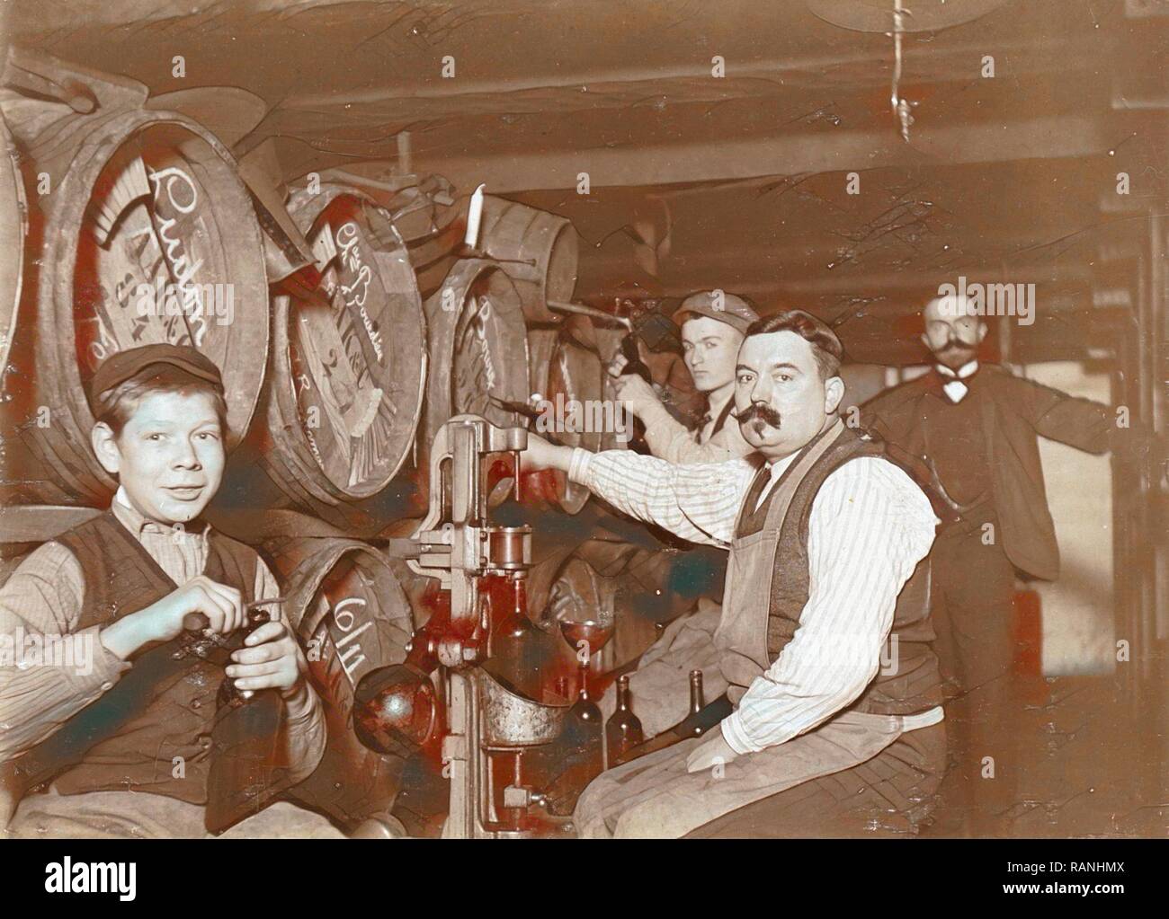 Brouwer and clerks in wine barrels and a corking machine, Anonymous, c ...