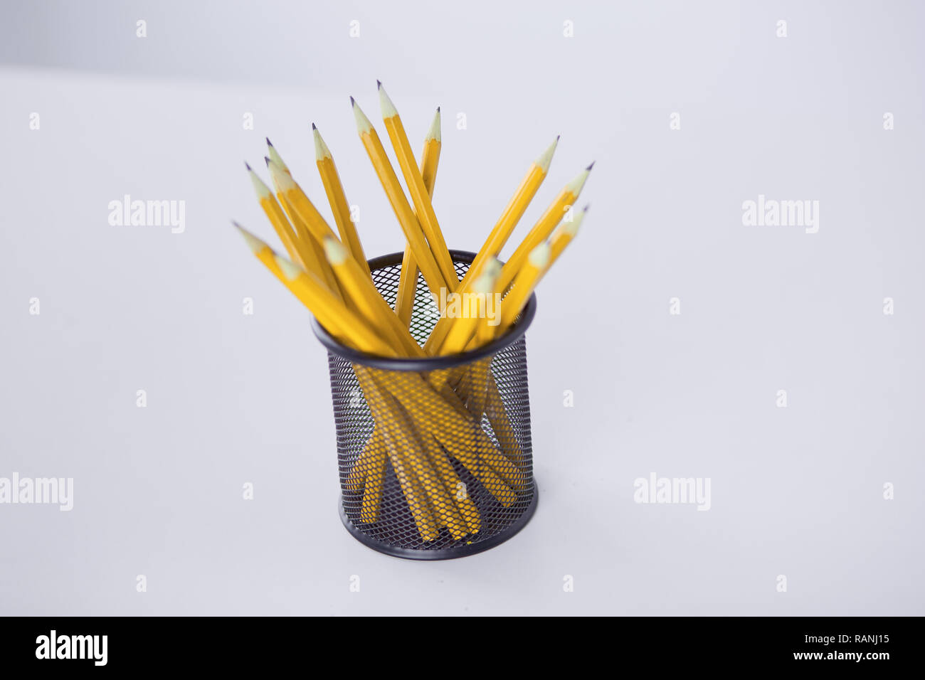 Graphite pencils in a metal grid-container. Concept Stock Photo - Alamy