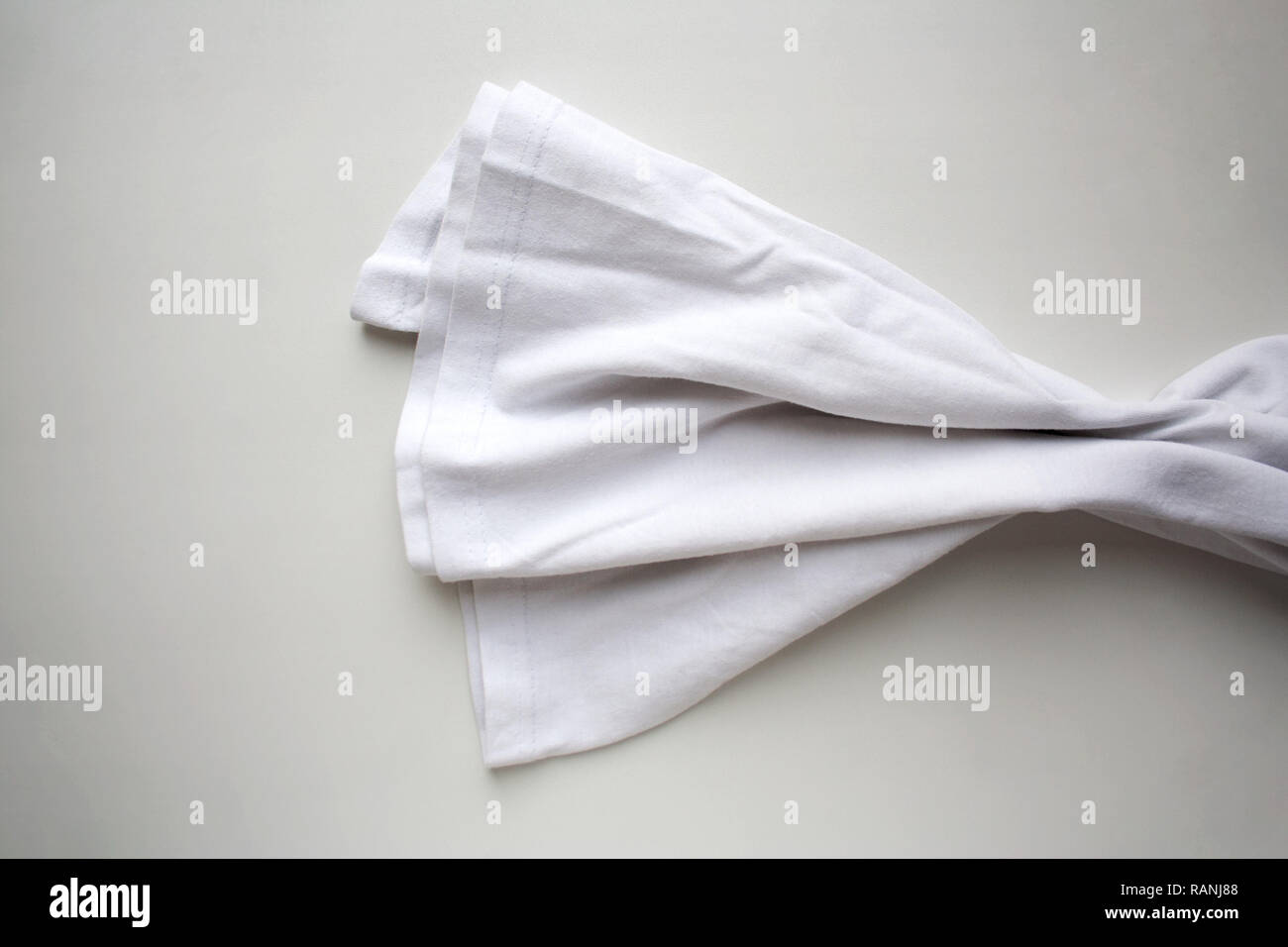 White folded cotton textile isolated on white background Stock Photo ...