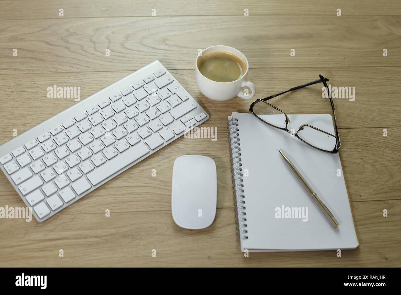 A cup of coffee on the office table Stock Photo - Alamy
