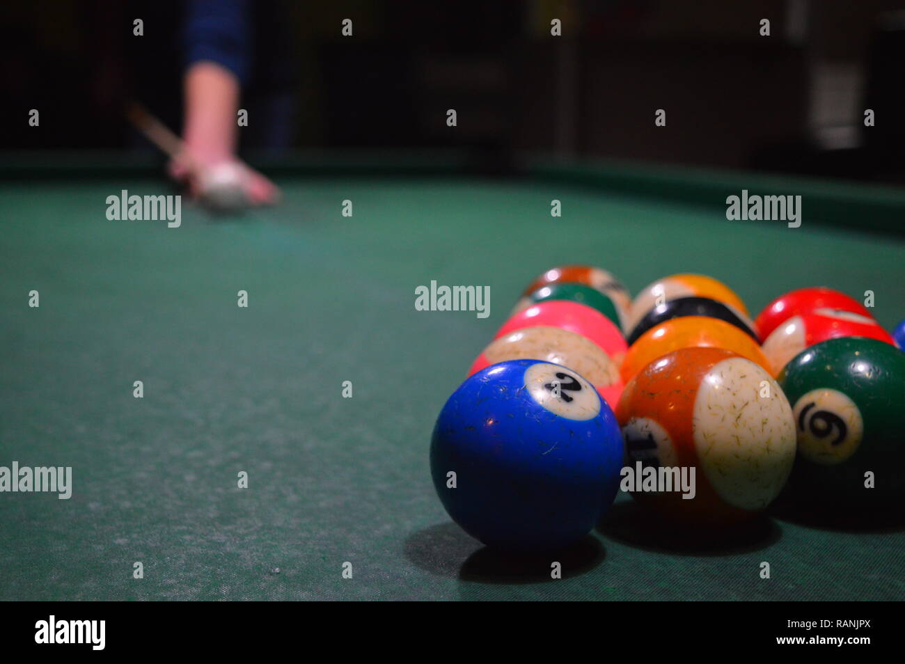 Game of pool, person playing pool and hitting balls Stock Photo - Alamy