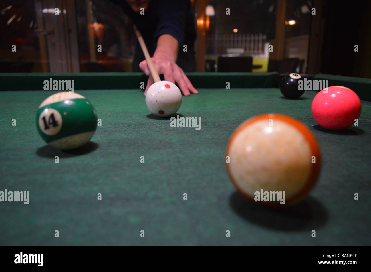 Game of pool, person playing pool and hitting balls Stock Photo - Alamy