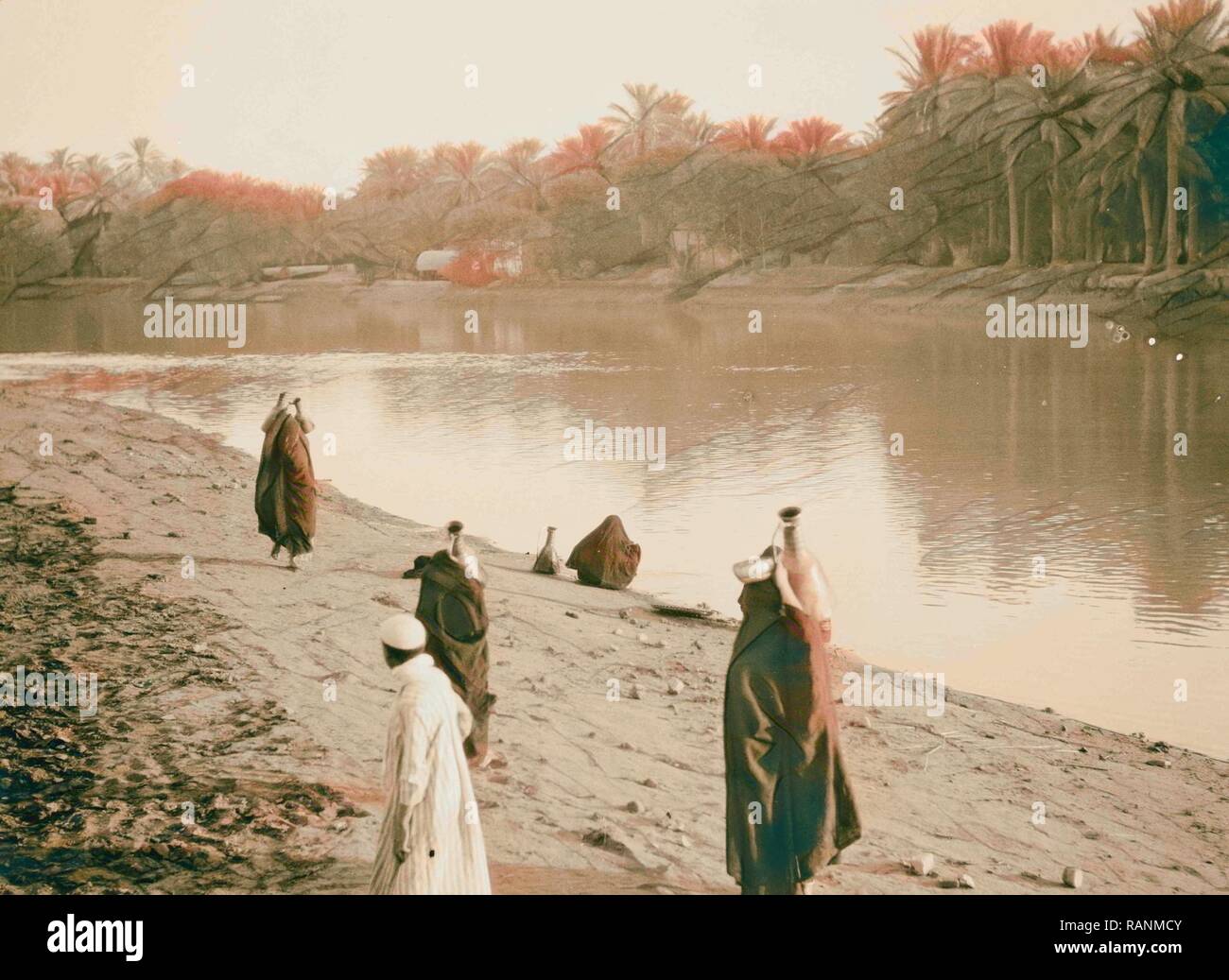 River scenes on the Euphrates taken at Hilla. Women carrying water from ...