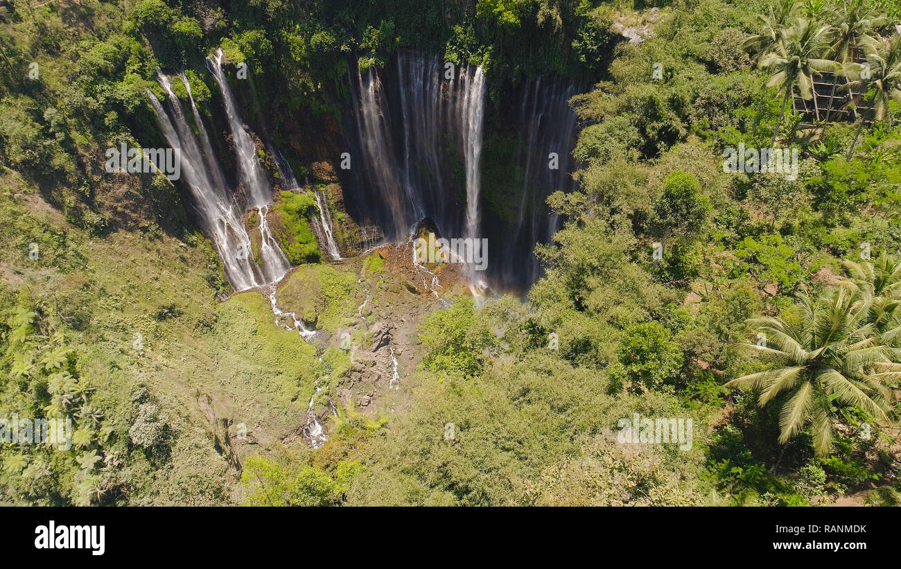 beautiful waterfall Coban Sewu in tropical forest, Java Indonesia ...