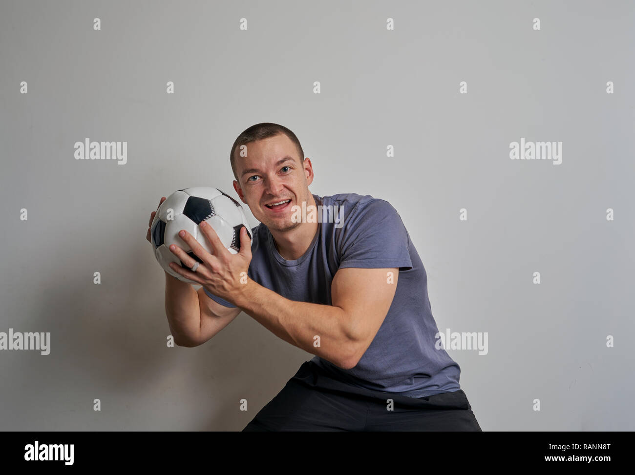 man with soccer ball on white background Stock Photo - Alamy