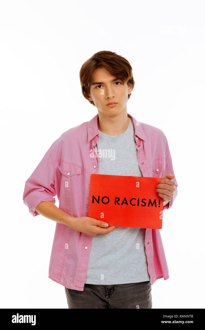 Nice serious man calling up against racism Stock Photo - Alamy
