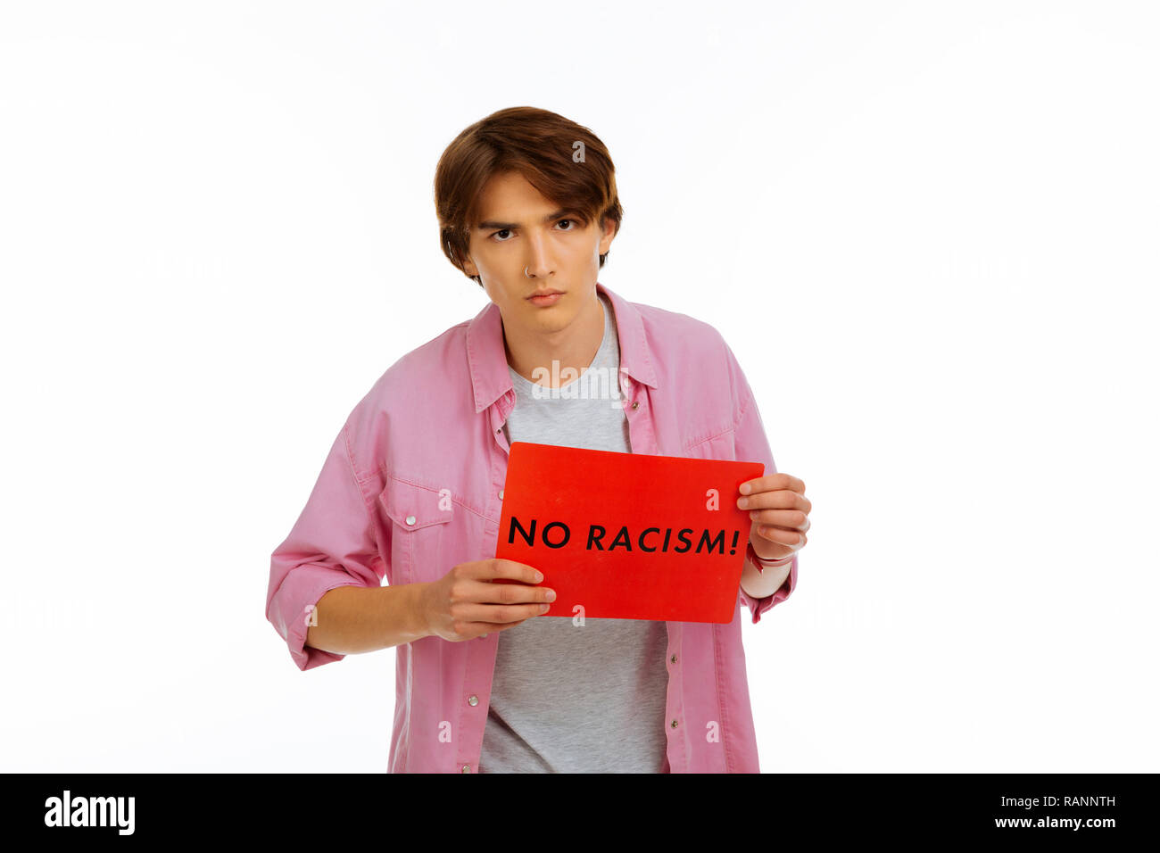 Pleasant young man expressing his tolerant attitude Stock Photo - Alamy