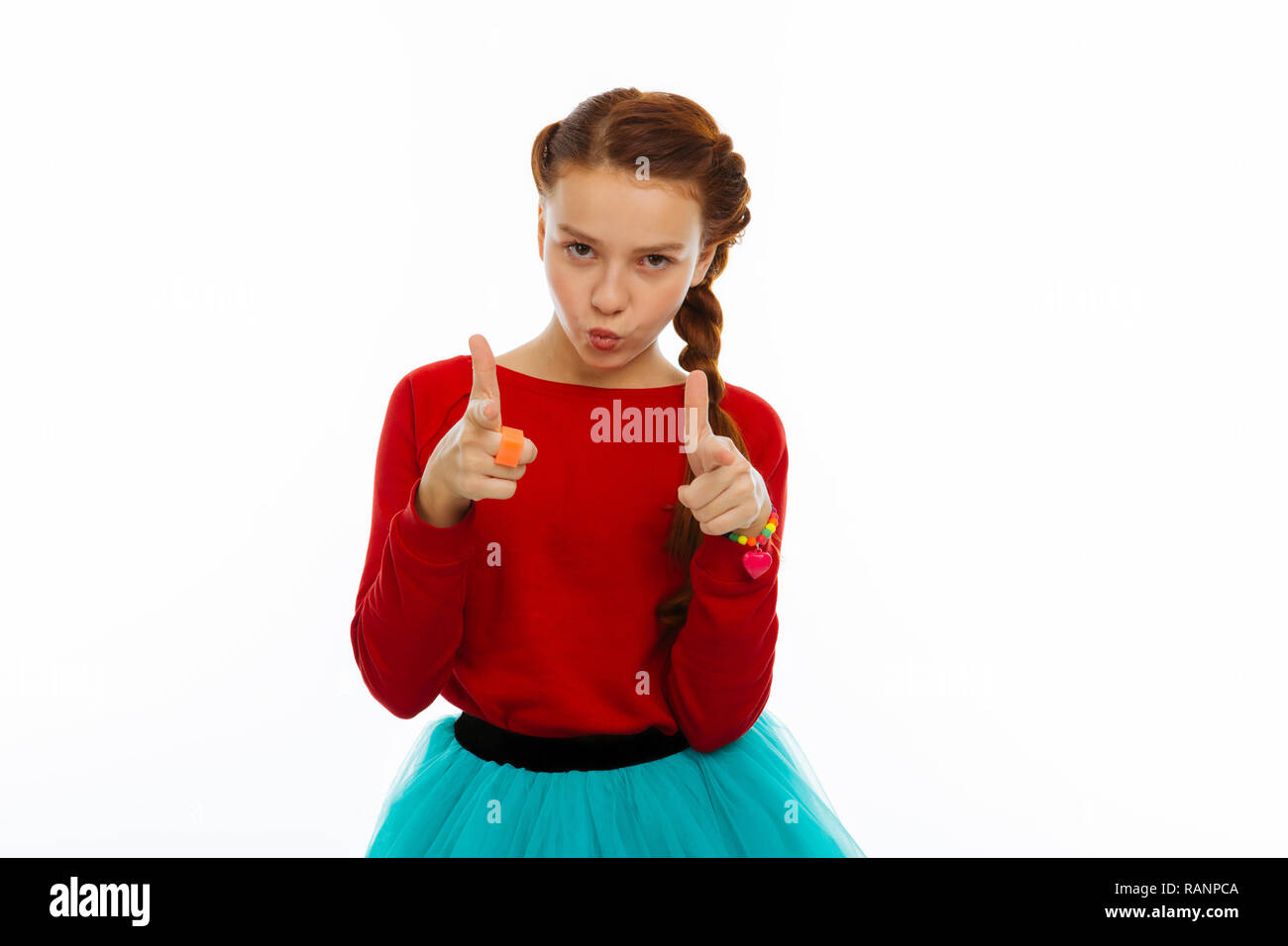 Nice cute pleasant girl pointing at you Stock Photo - Alamy