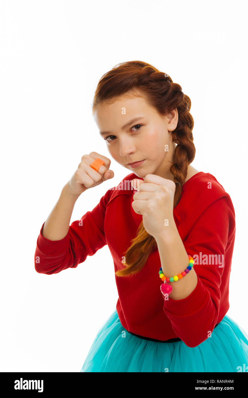 Nice serious girl being ready to fight Stock Photo - Alamy
