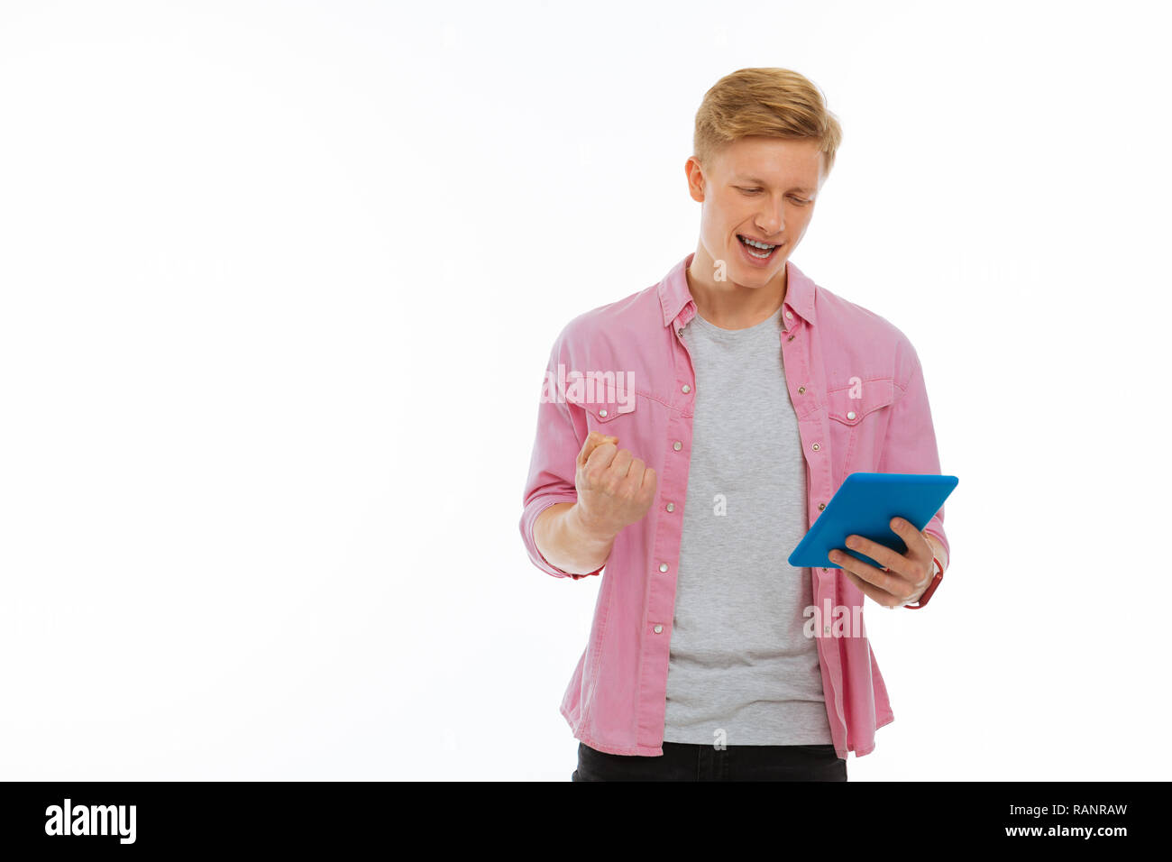 Joyful nice young man feeling very happy Stock Photo - Alamy