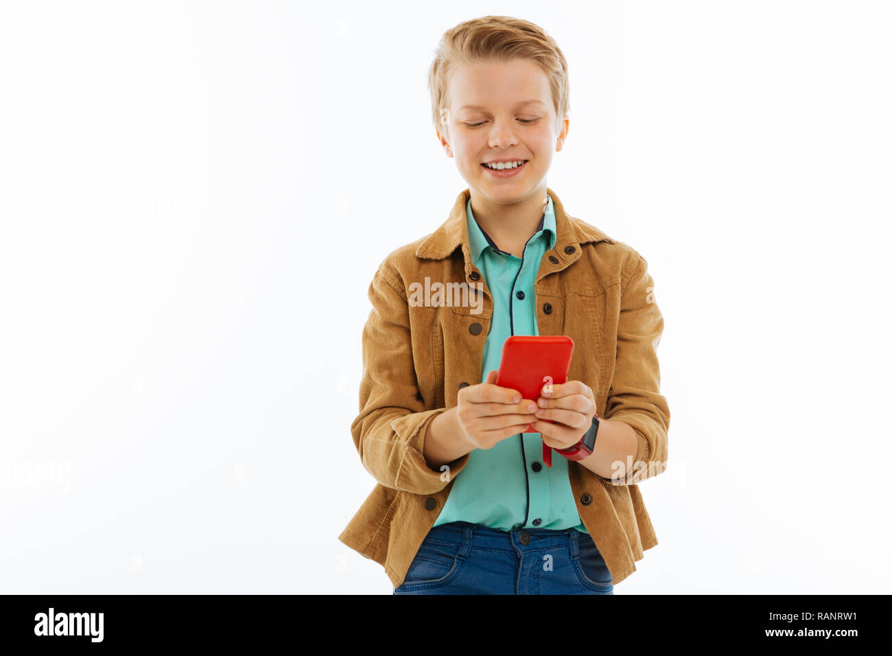 Happy cheerful young boy communicating on the internet Stock Photo - Alamy
