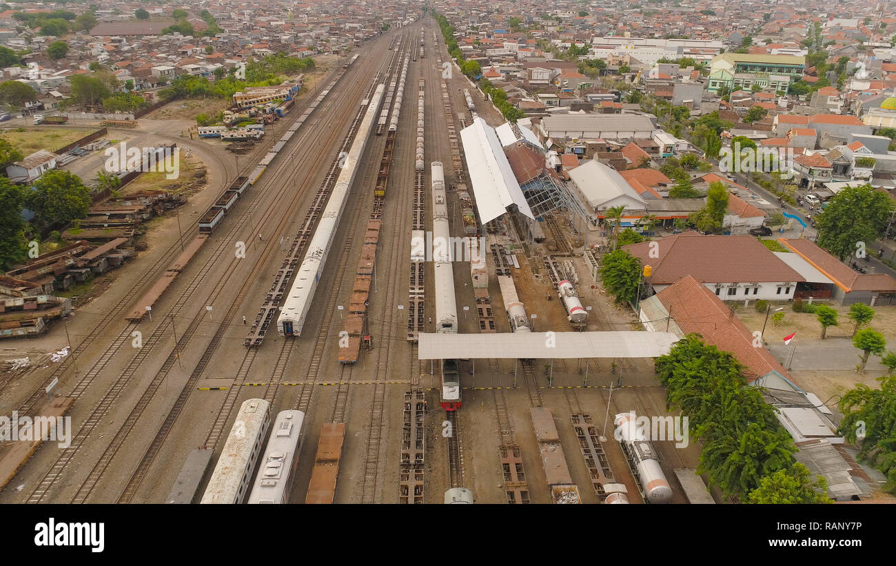 freight train with cisterns and containers on railway station Surabaya ...