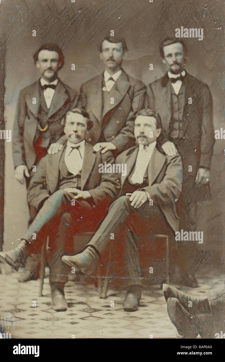 Group portrait of five men, standing and sitting in a studio (right two ...