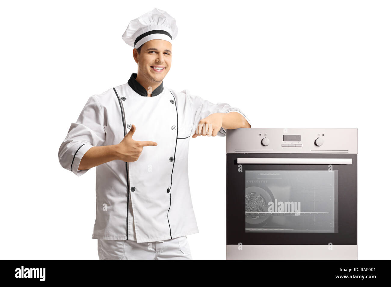 Male chef pointing to an oven isolated on white background Stock Photo ...