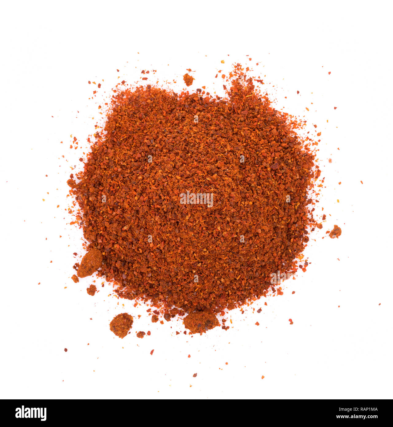 Pile of red paprika powder on white background Stock Photo - Alamy