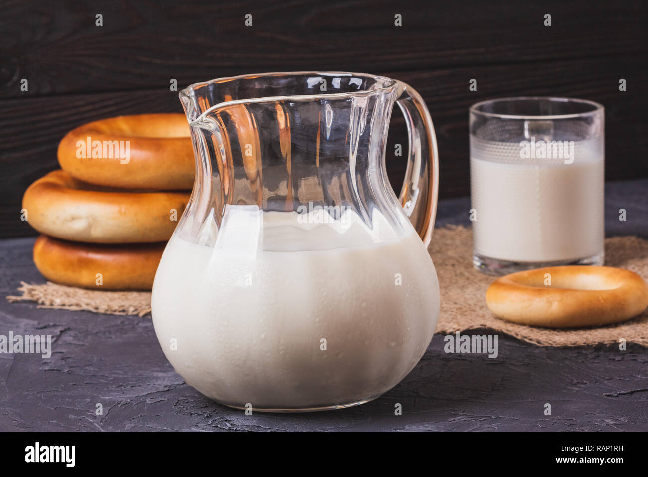 Healthy breakfast milk in jug and bagels Stock Photo - Alamy