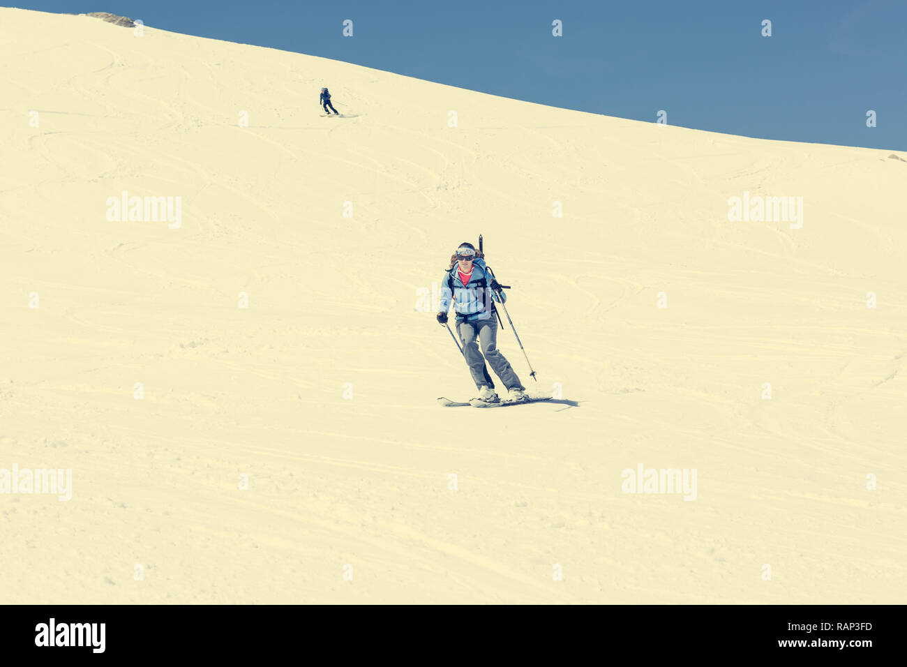Female back-country skier tackling a steep slope Stock Photo - Alamy