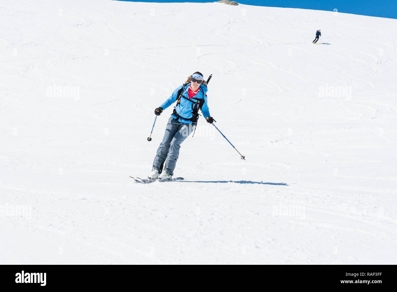 Female back-country skier tackling a steep slope Stock Photo - Alamy