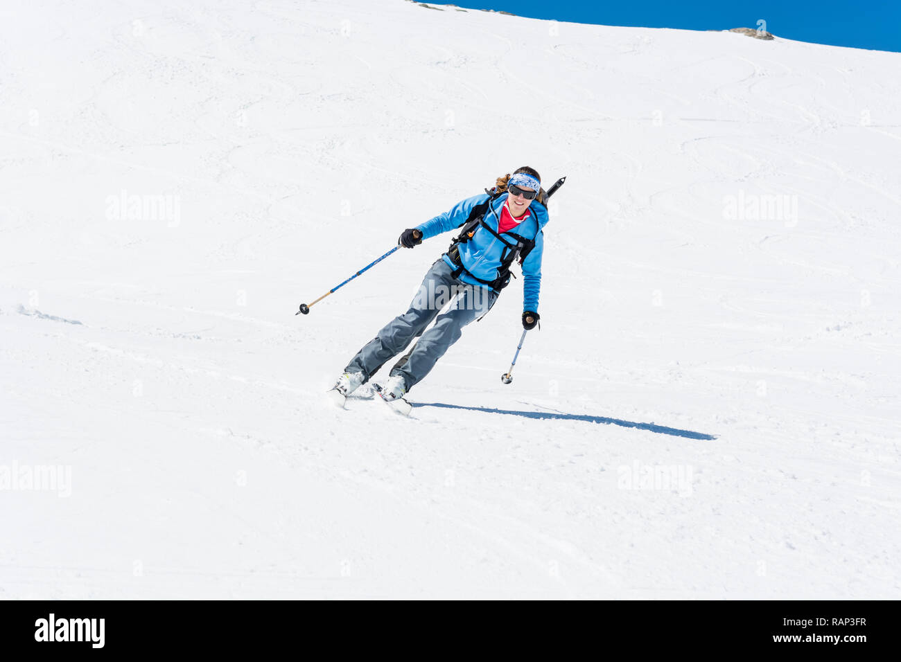 Female back-country skier tackling a steep slope Stock Photo - Alamy