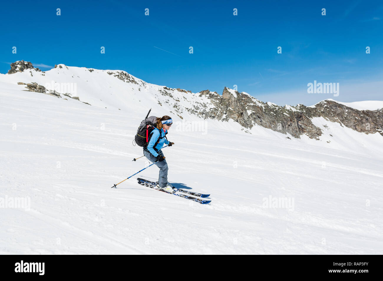 Female back-country skier tackling a steep slope Stock Photo - Alamy