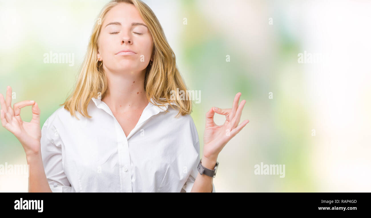 Beautiful young business woman over isolated background relax and ...
