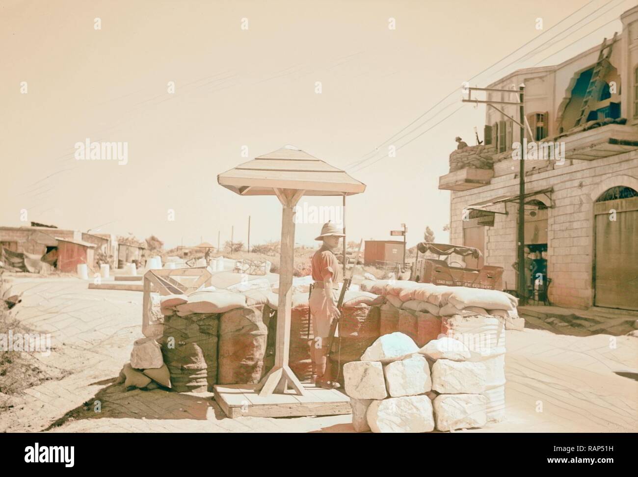 Military road block at junction Ramleh-Lydda Road, later with shade ...