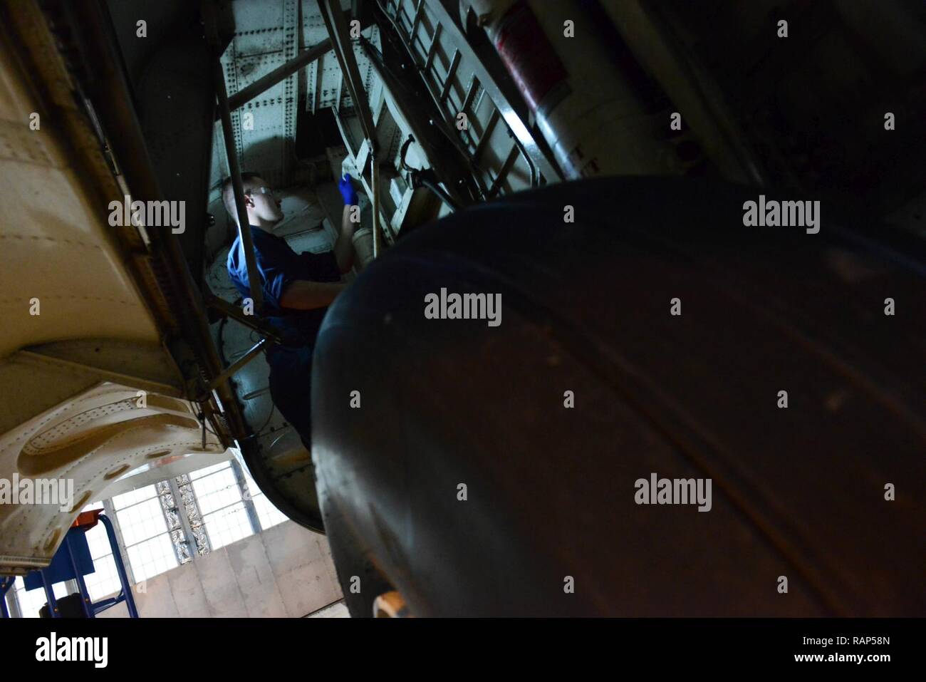 Petty Officer 3rd Class Tanner Boggs performs preventative maintenance ...