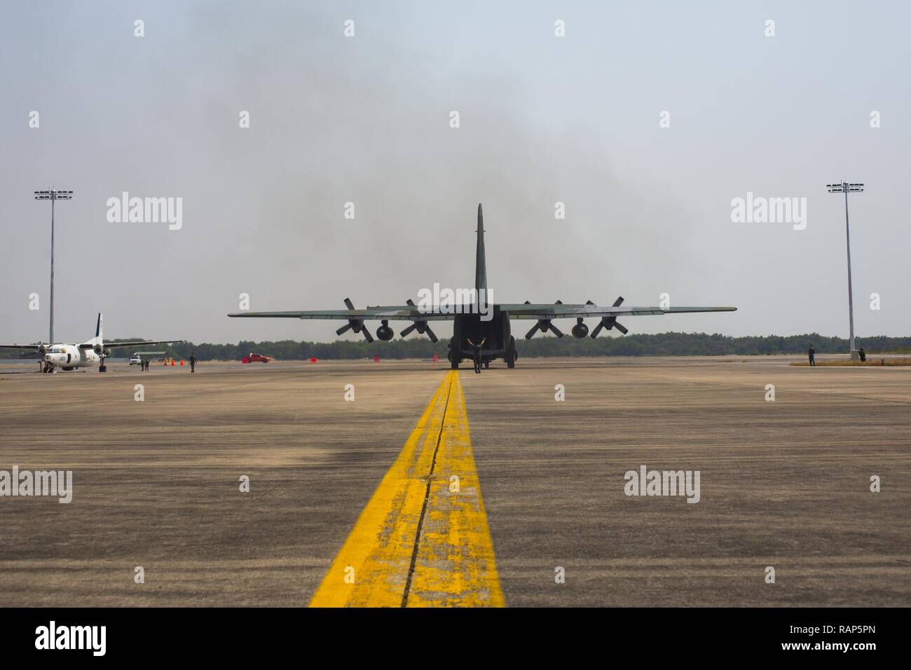 A Japanese Self-Defense Force C-130 aircraft taxis the runway during a ...
