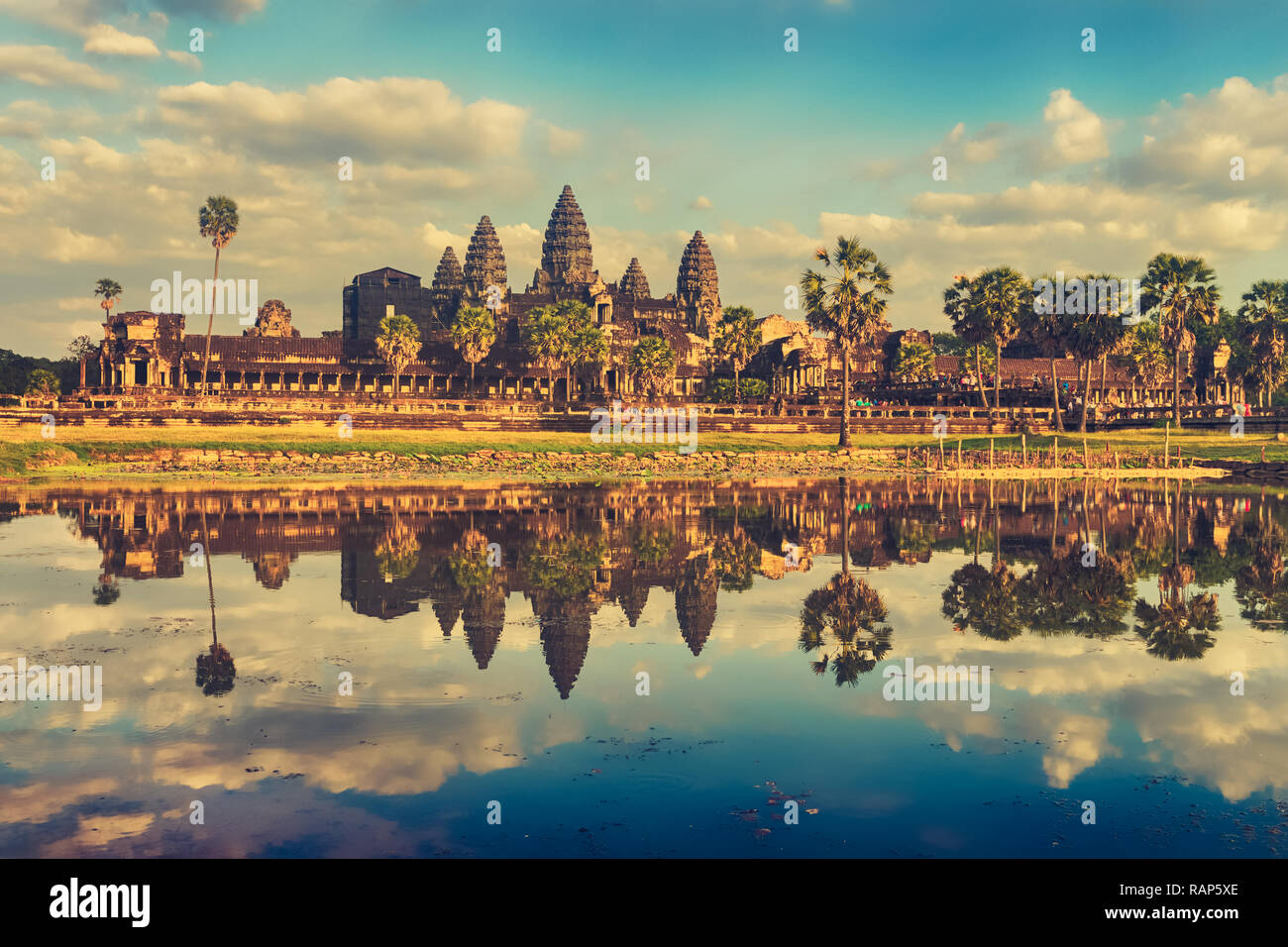Angkor Wat temple reflecting in water of Lotus pond at sunset. Siem ...