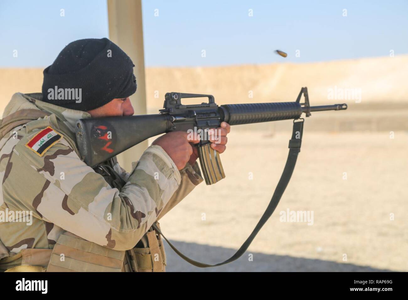 An Iraqi security forces soldier from 7th Iraqi Army Division fires his ...