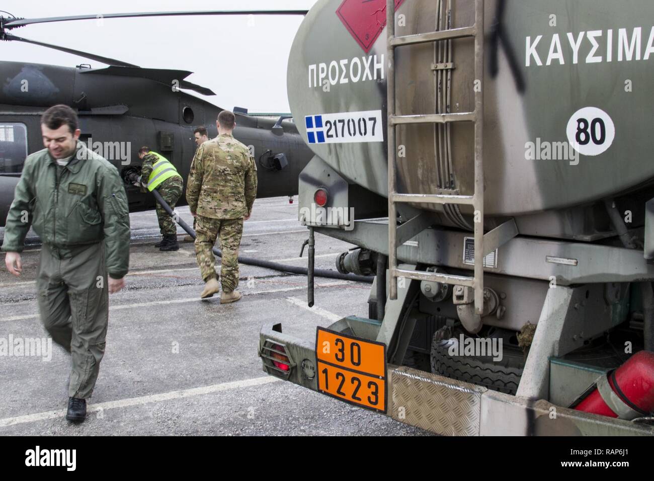 Refuelers with the Hellenic Army provide fuel to a UH-60 Black Hawk ...