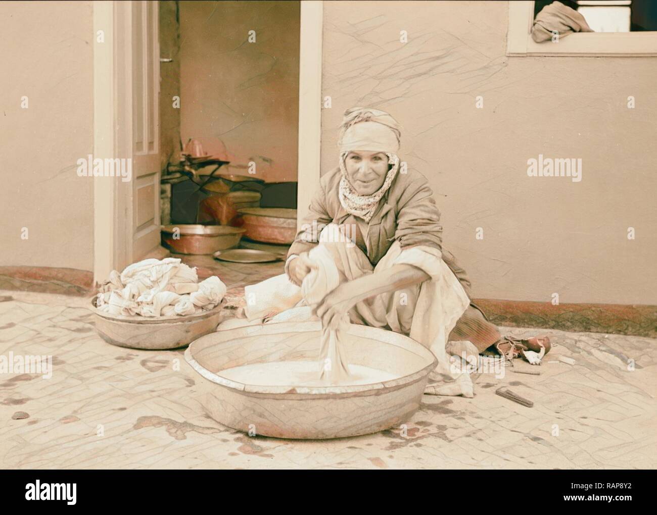 Bukharan Jewish washwoman. Bukharan Jewish woman washing textiles in a ...