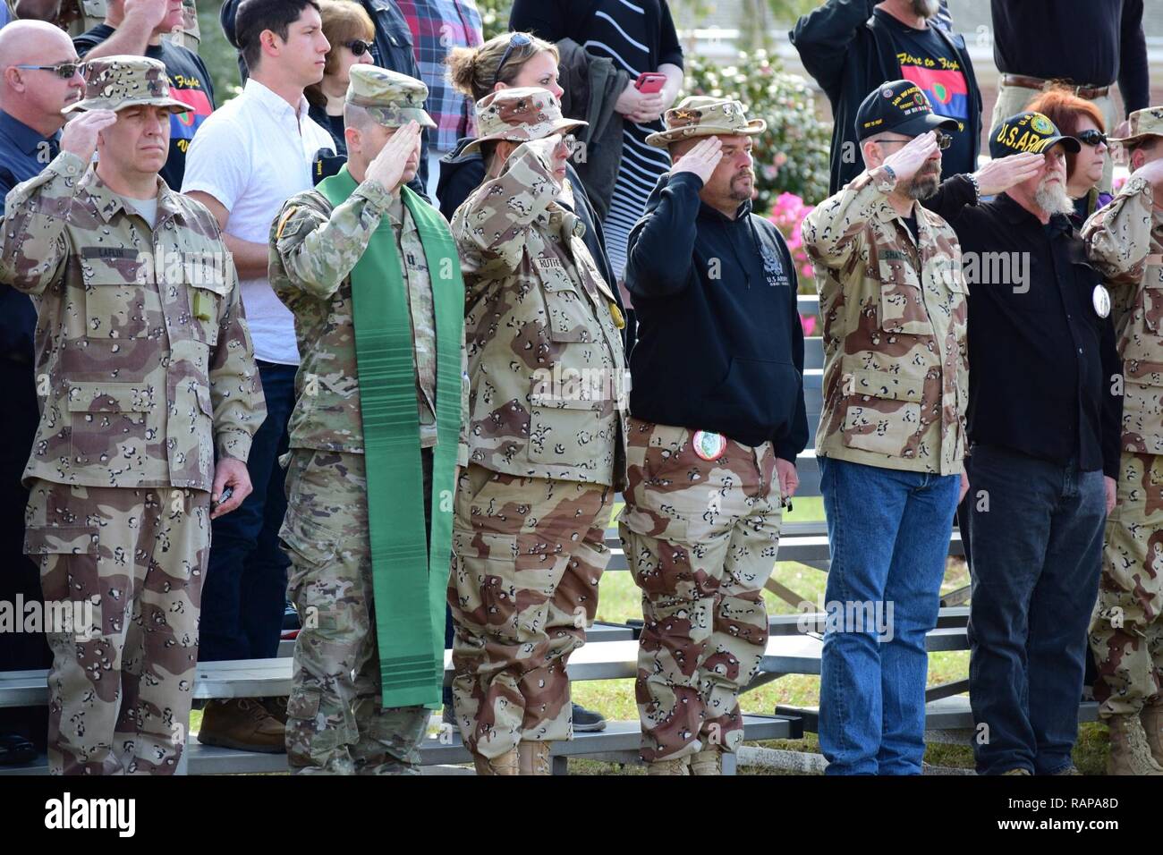 Veterans from the 24th Infantry Division salute the flag as the band ...