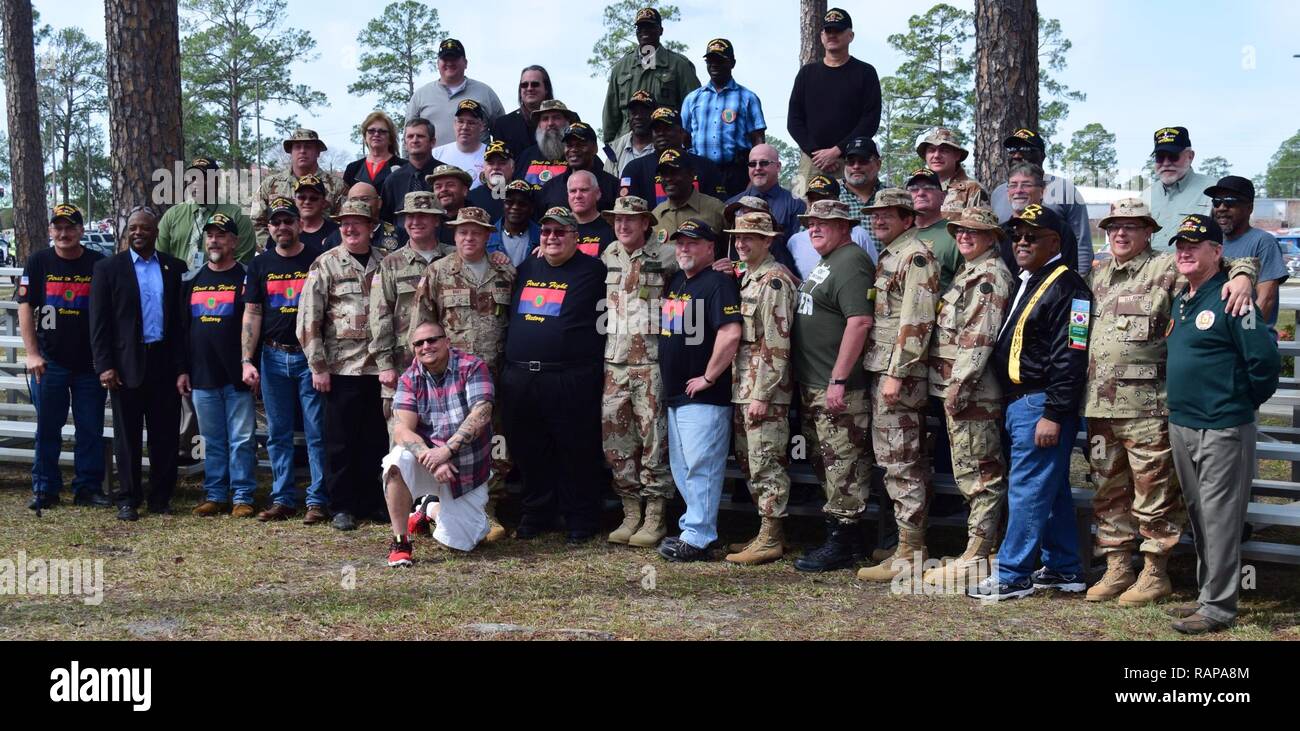 Veterans from the 24th Infantry Division take a group photo to show ...