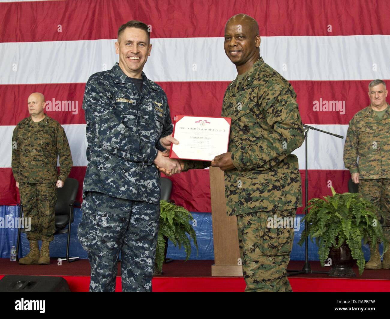 U.S. Navy Rear Adm. Michael W. Zarkowski, left, poses for a photo with ...