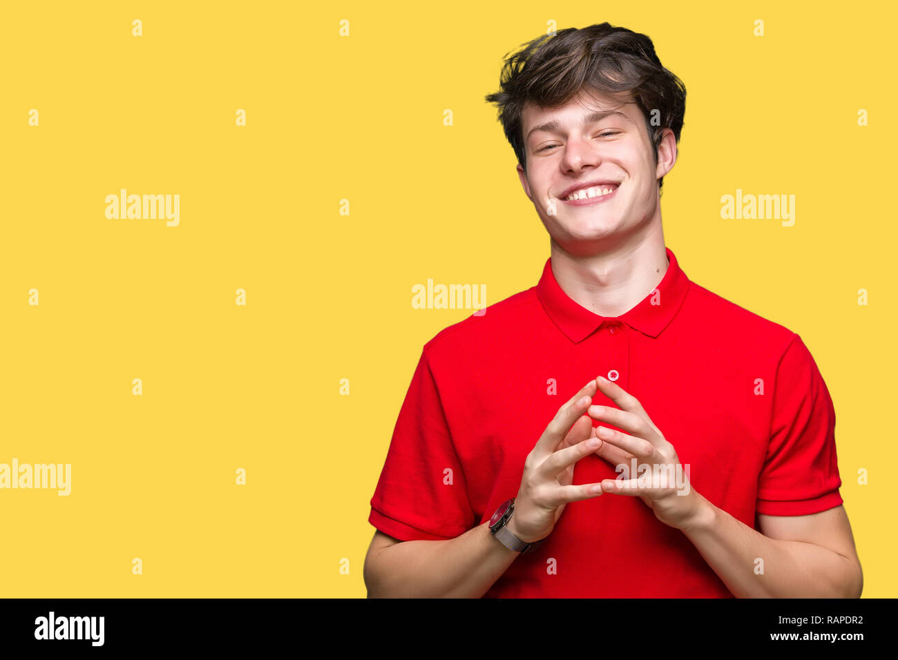 Young handsome man wearing red t-shirt over isolated background Hands ...