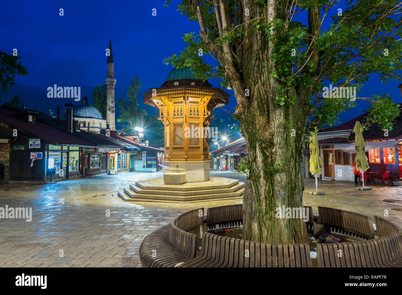 Illuminated Sebilj ottoman-style wooden fountain at sunrise, Bascarsija ...