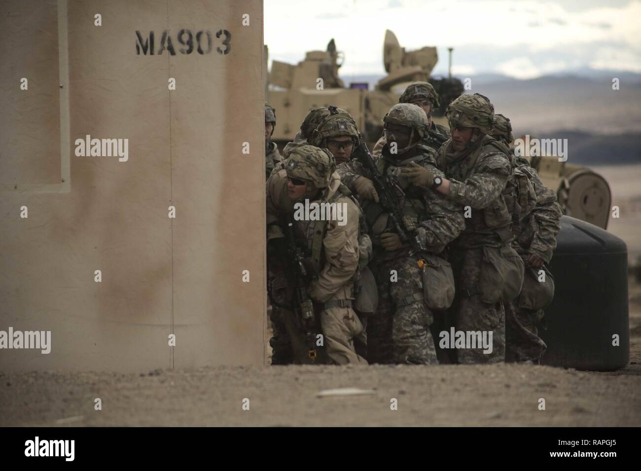 U.S. Soldiers, assigned to 2nd Brigade, 1st Cavalry Division, stack up ...