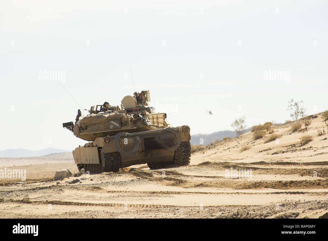 U.S. Soldiers in an Abrams Tank, assigned to the 2nd Brigade, 1st ...
