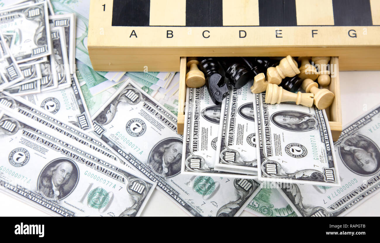 Strategy Playing Game Chess and Money on Chessboard Stock Photo - Alamy