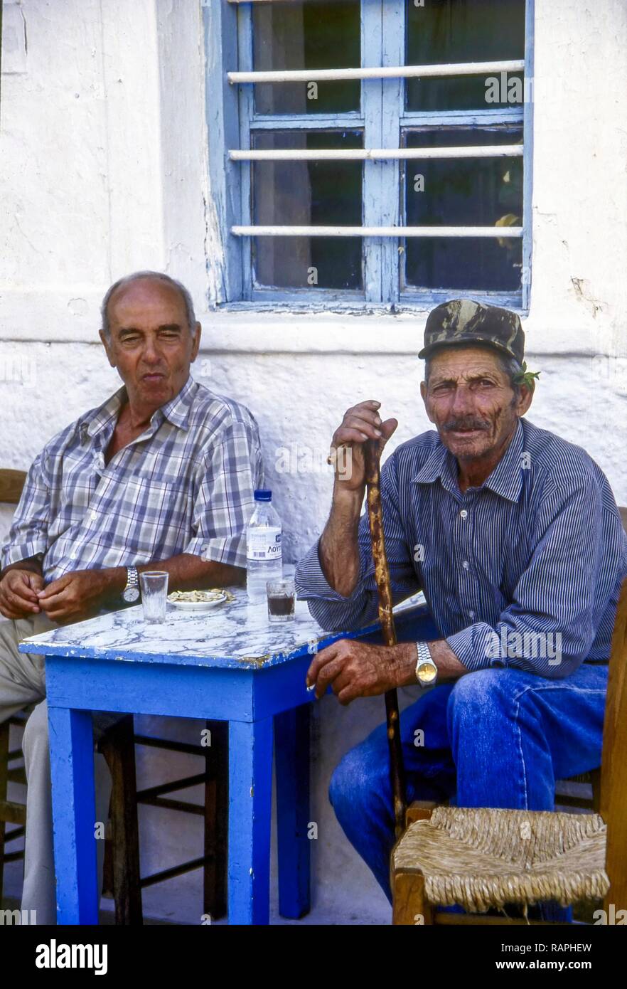 Elderly Men sat relaxing and drinking coffee outside a Kafeneio, Coffee ...