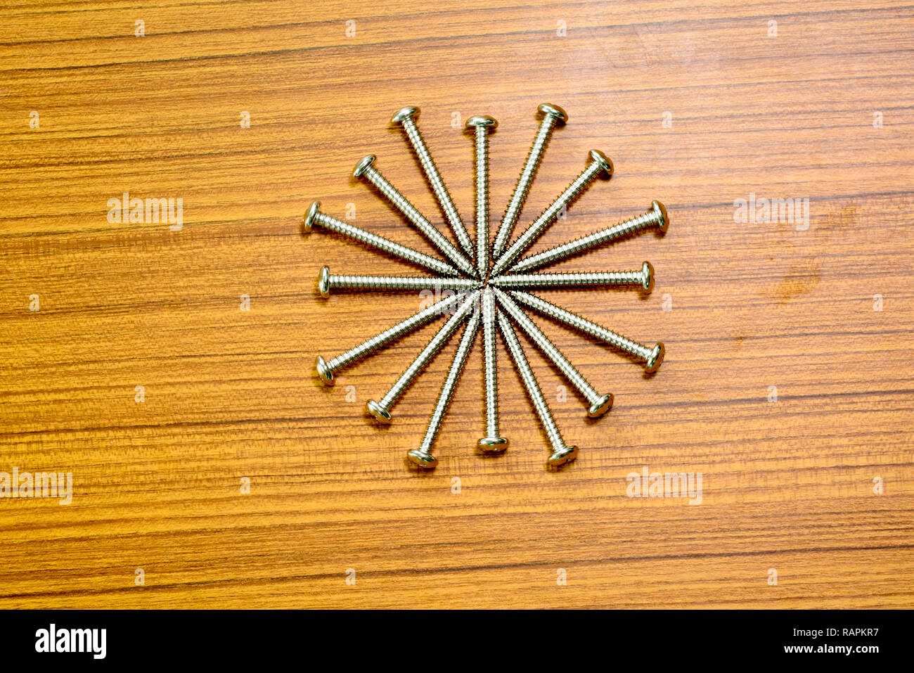 Salf tapping screw on a wood background Stock Photo - Alamy