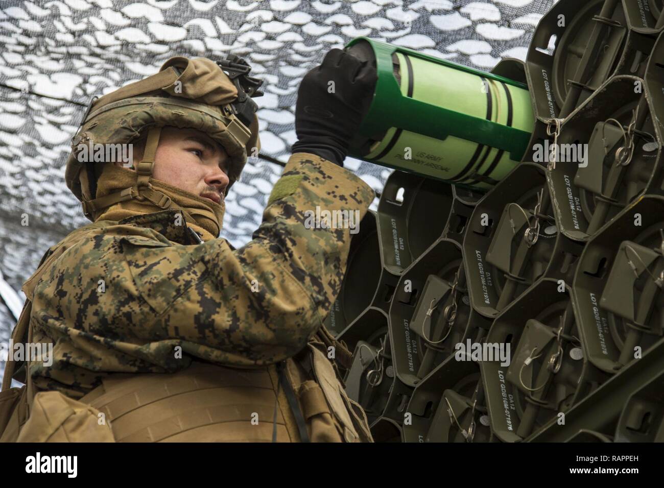 U.S. Marine Corps Lance Cpl. William Rivers, a number 3 cannoneer with ...