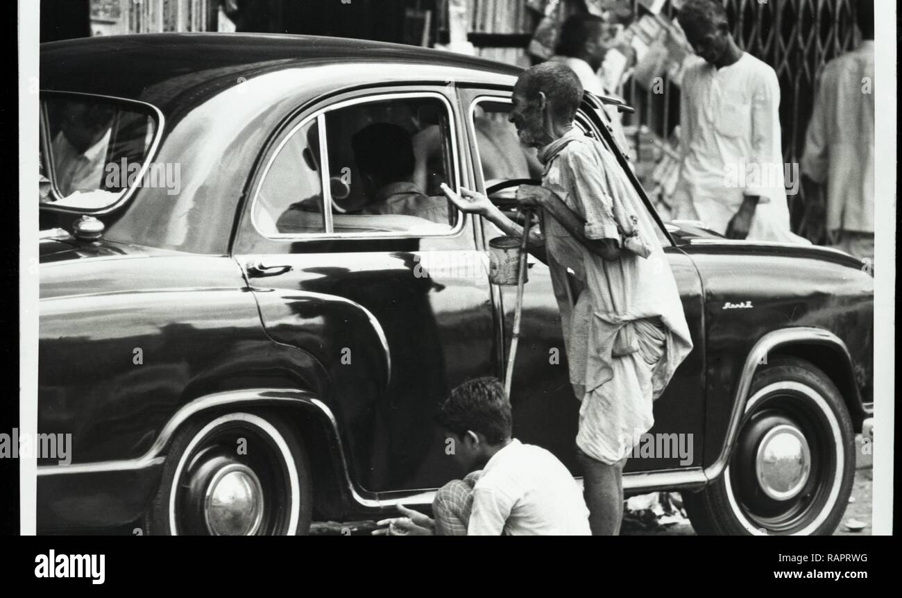 man at a car with his hand out Stock Photo - Alamy