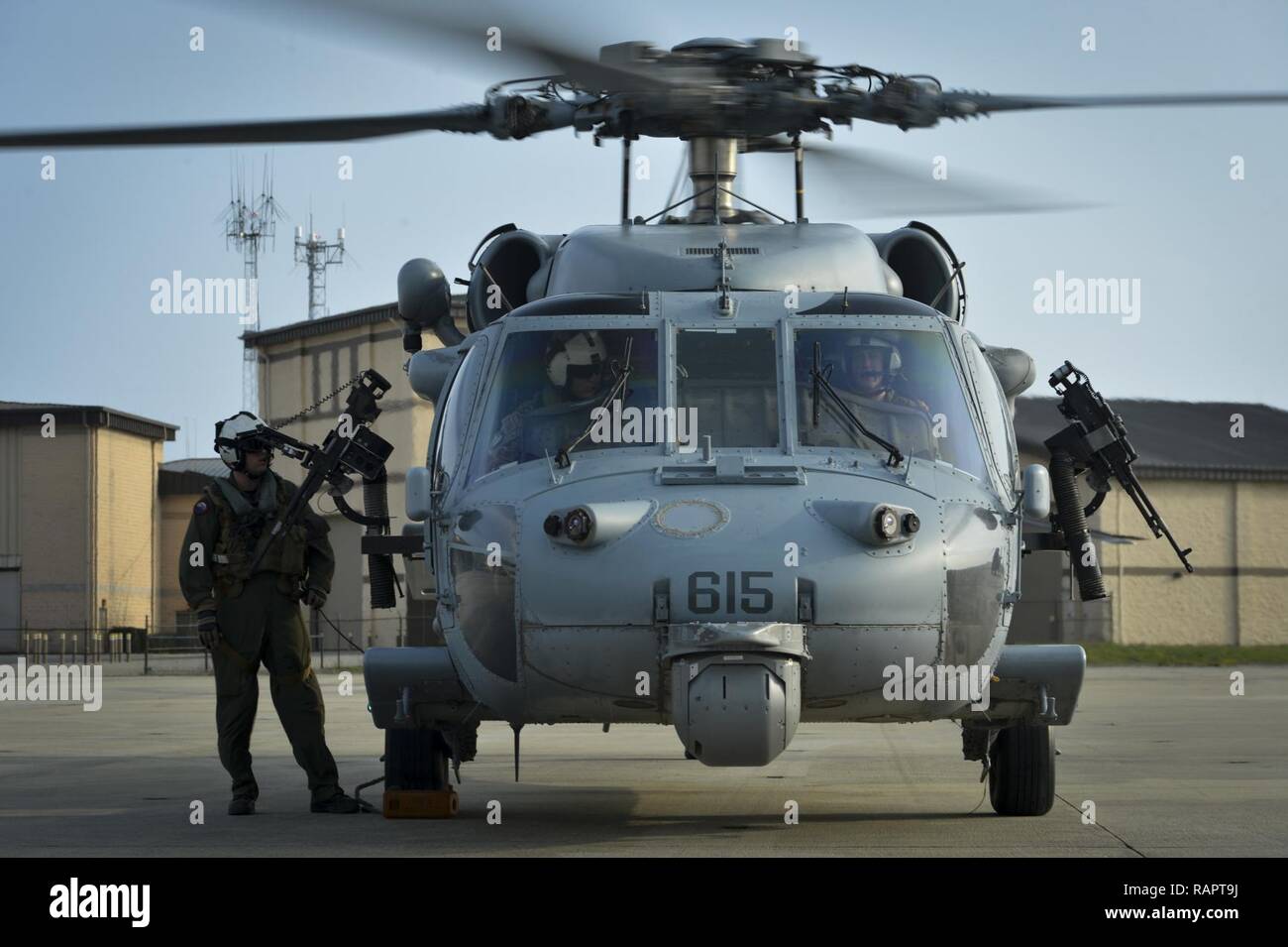 A U.S. Navy aircrew from Helicopter Sea Combat Squadron 5 prepare an MH ...