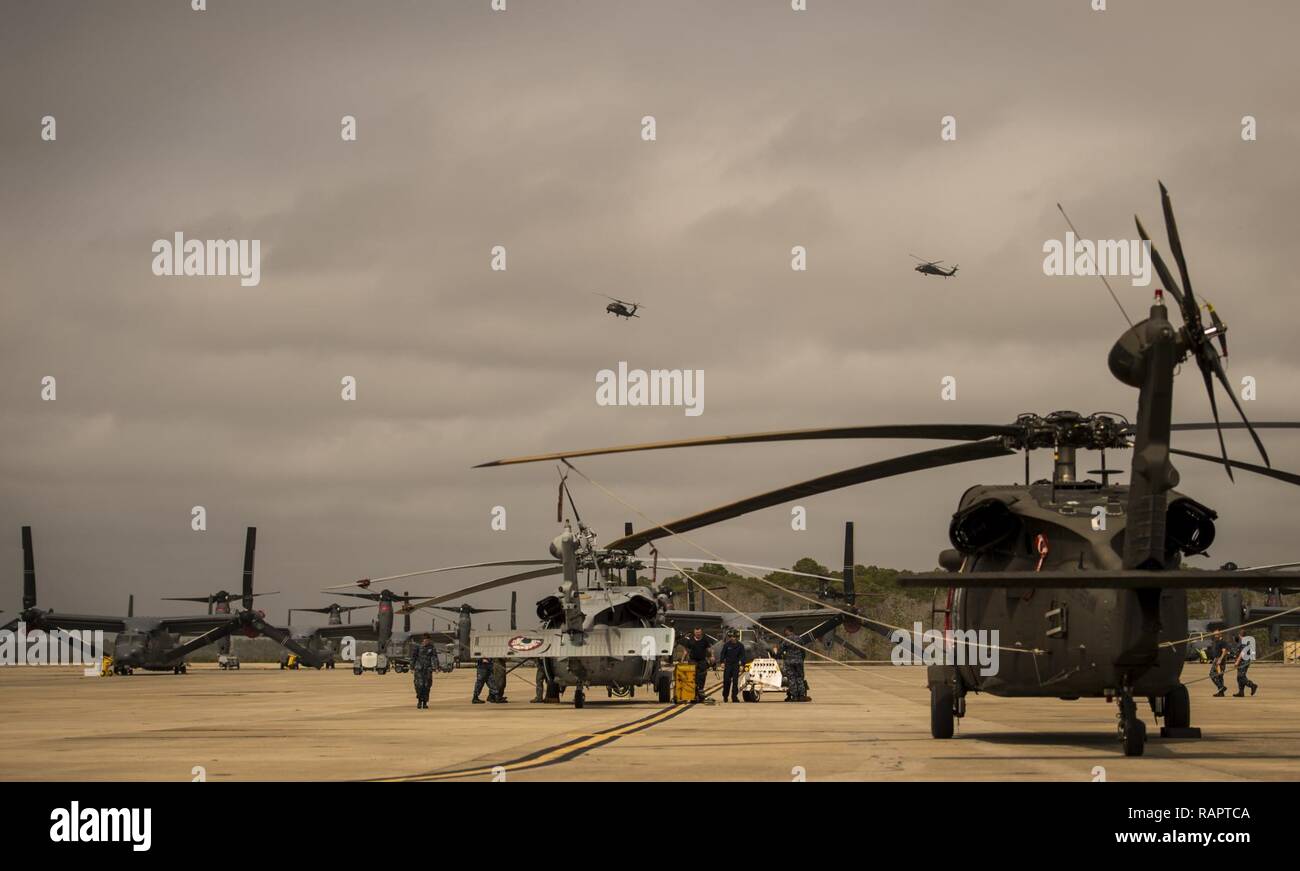 U.S. Navy aircrew from Helicopter Sea Combat Squadron 5 prepare a SH-60 ...
