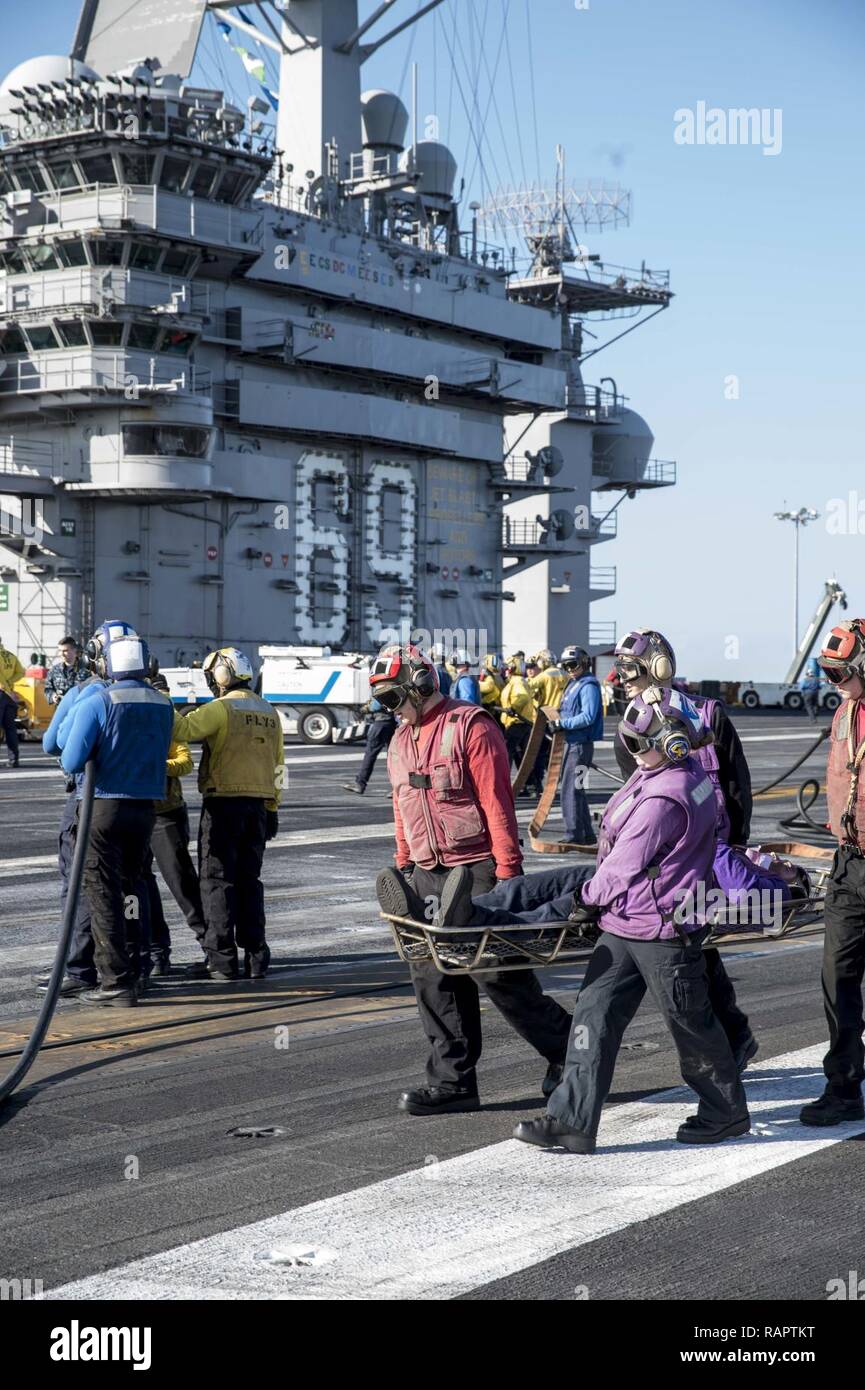 NORFOLK, Va. (Feb. 28, 2017) Sailors carry a stretcher during a mass ...
